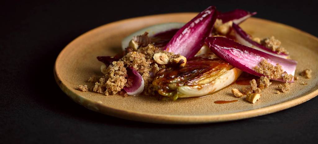 Rosehip Braised Chicory with Hazelnuts & Crispbread | Eatery Berlin